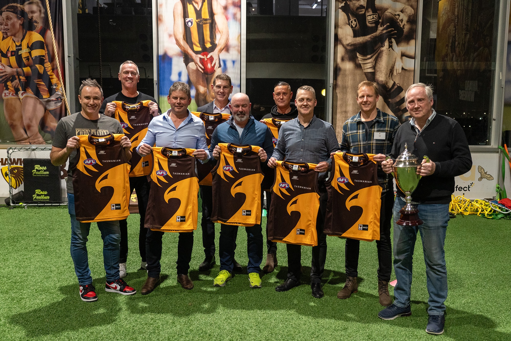 Former Hawks celebrate the 1999 Ansett Cup Night Premiership