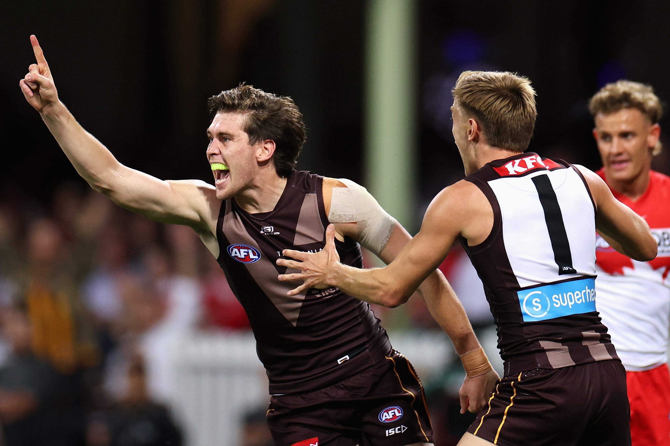 Day stars as Hawks blast past Swans in season opener